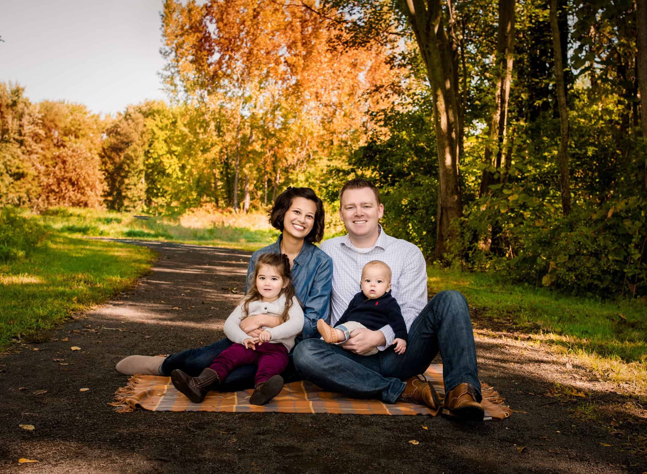 Family Playing Outside In Fall